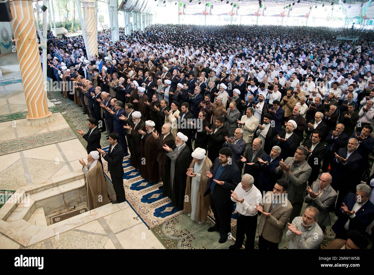 Iranian worshippers perform their Friday prayer at the Tehran ...