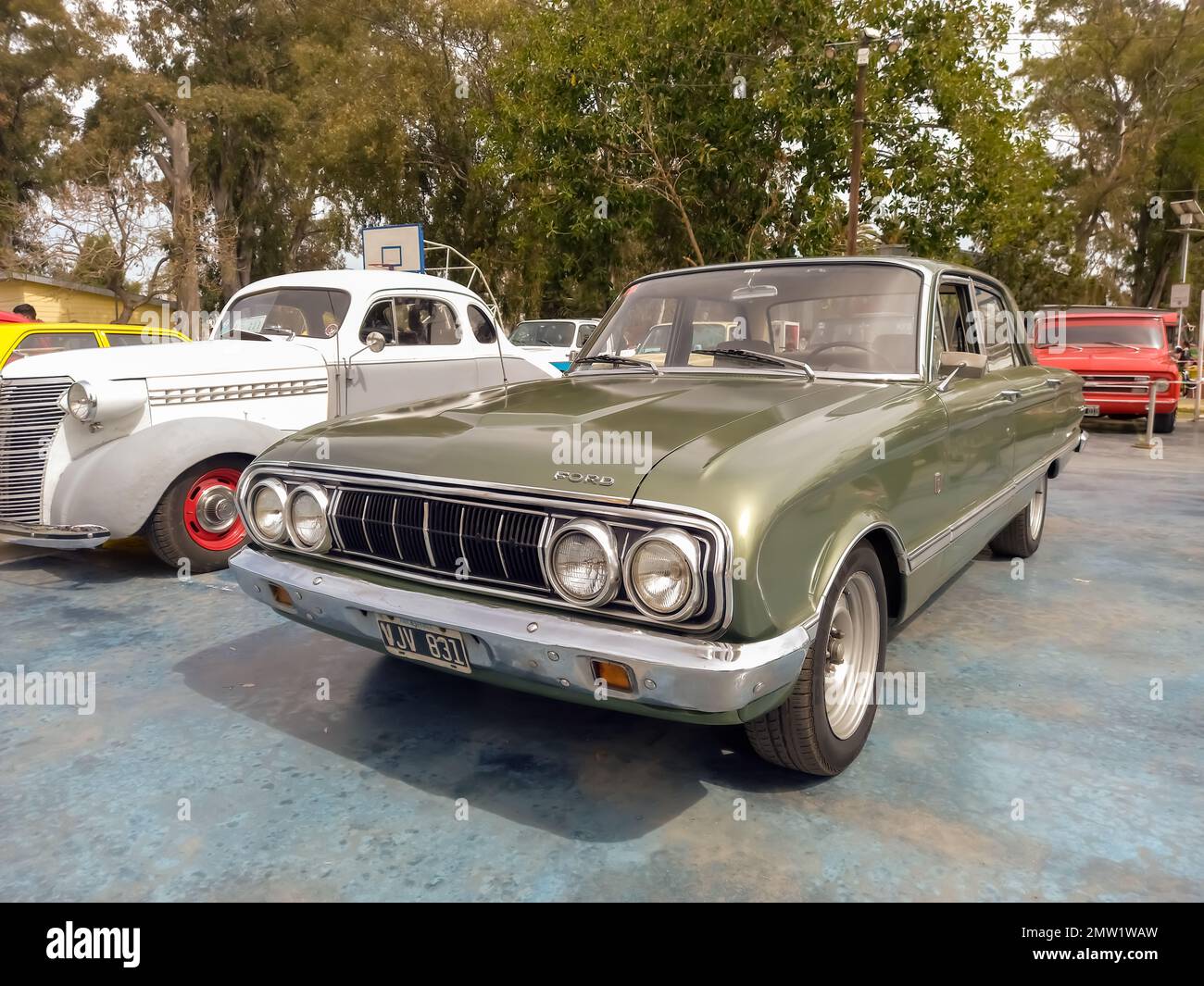 Old green Ford Falcon Deluxe sedan compact family car early 1970s in a ...