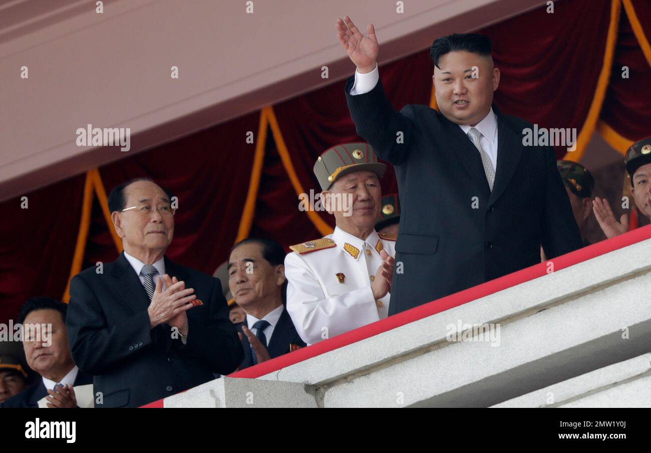North Korean leader Kim Jong Un, right, waves while Kim Yong Nam ...
