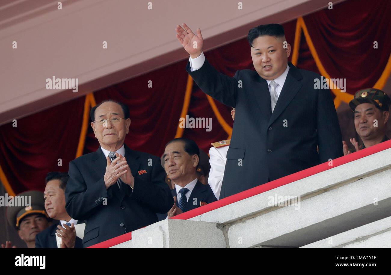 North Korean leader Kim Jong Un, right, waves while Kim Yong Nam, third ...
