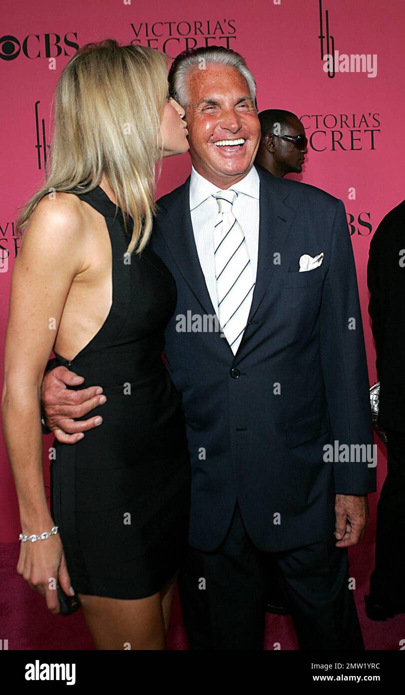 Actor George Hamilton receives a kiss from his wife Kimberly Blackford ...