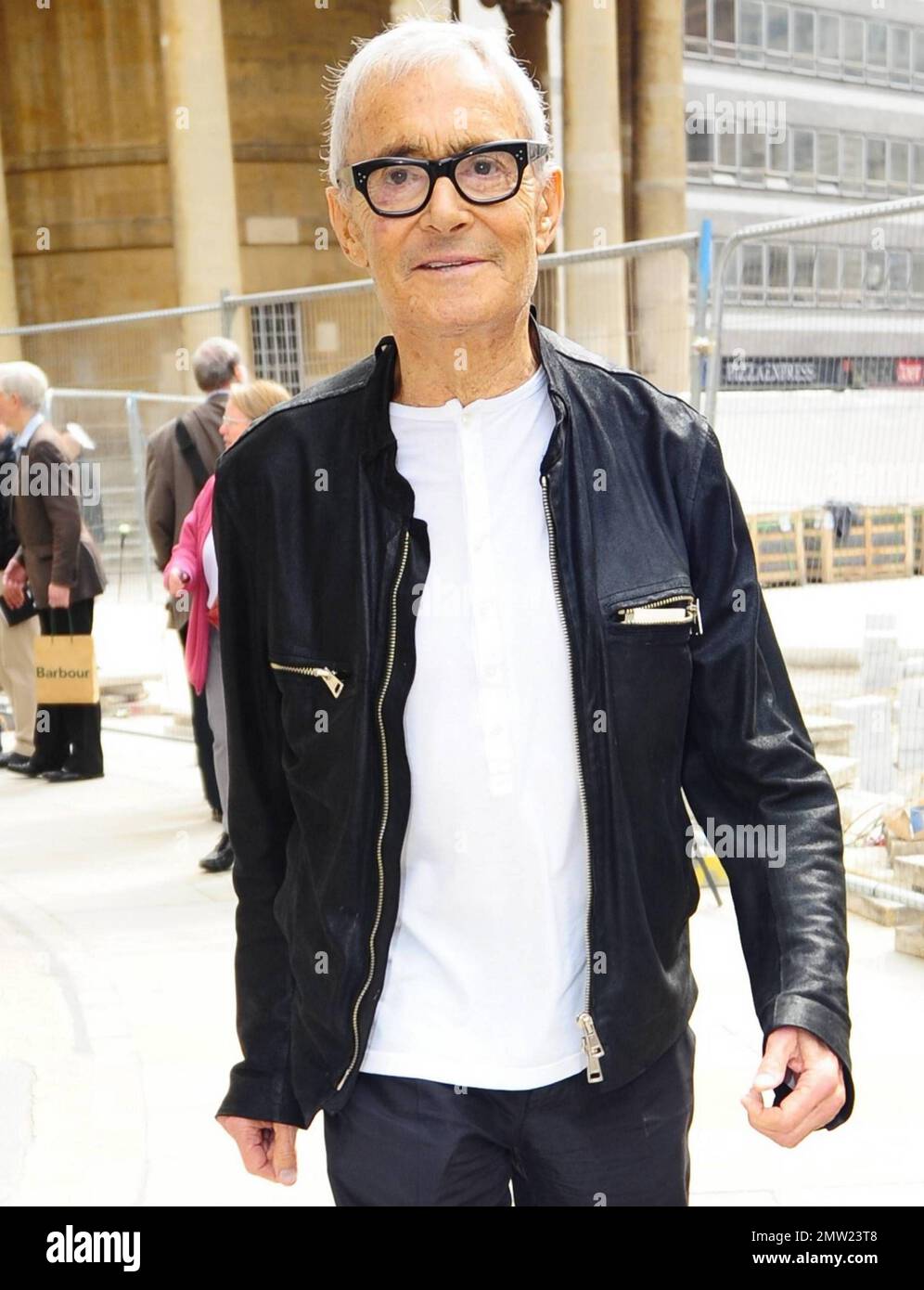 Hairdresser and businessman Vidal Sassoon gives the thumbs up while out ...