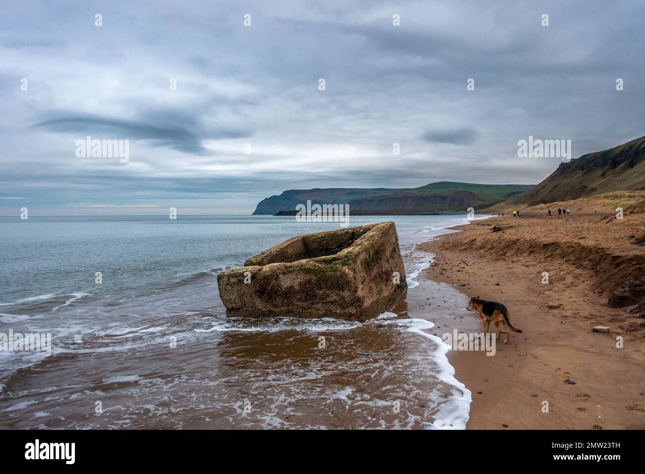Military pillbox half buried in the sand at Skinningrove Beach ...