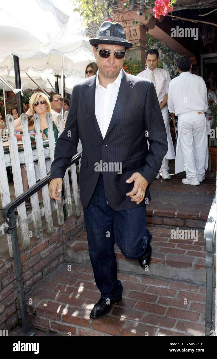 Vinnie Jones looks dapper in a hat, shades and blazer as he leaves The ...