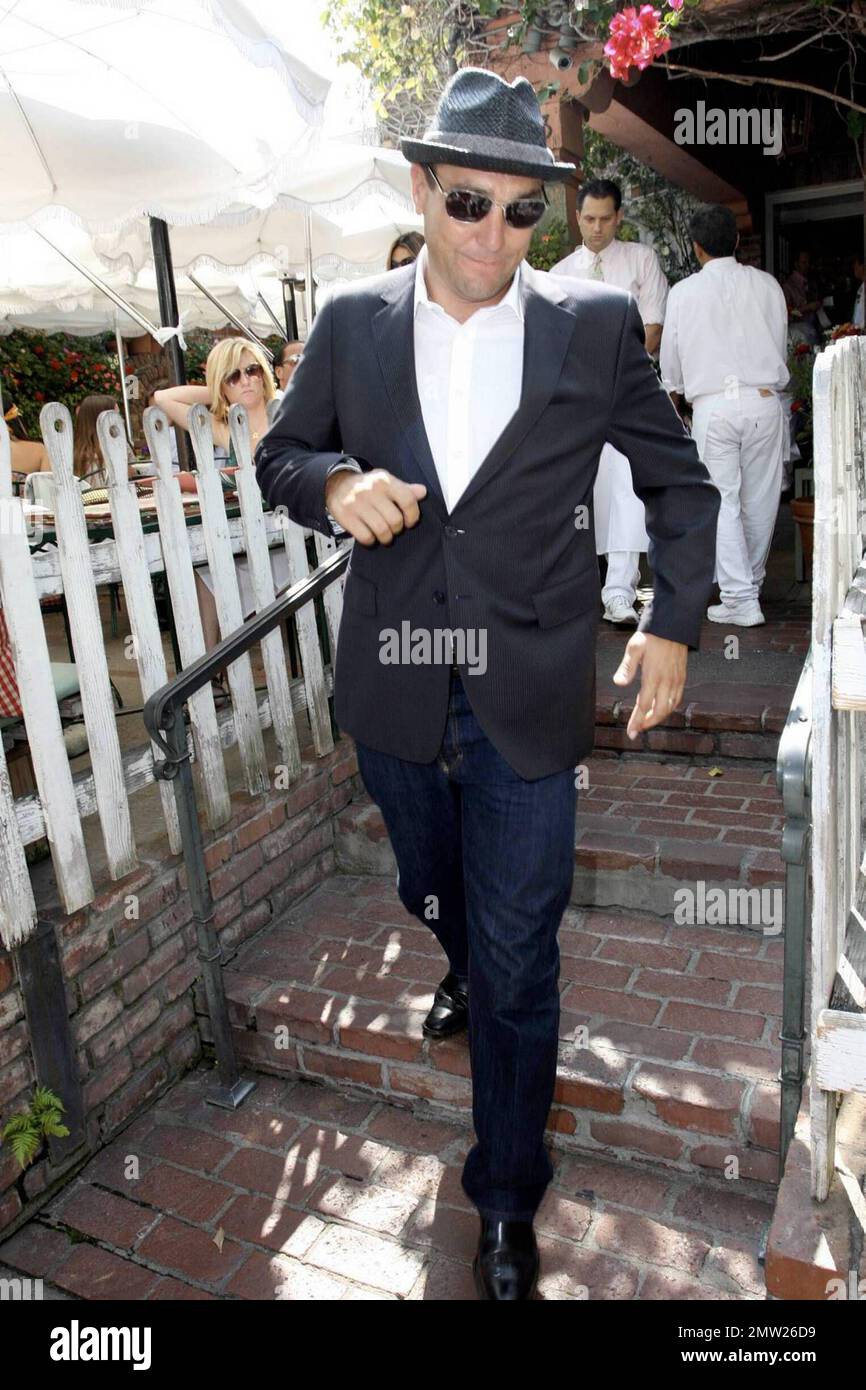 - Vinnie Jones looks dapper in a hat, shades and blazer as he leaves ...