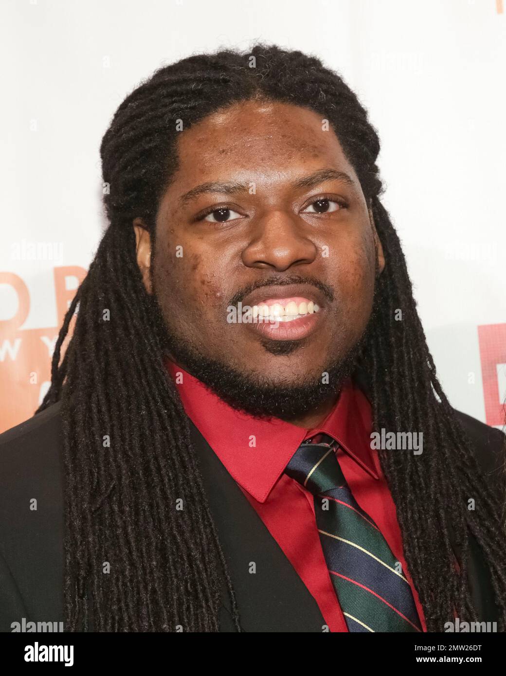 Professional football player Adam Gettis attends the Food Bank for New ...