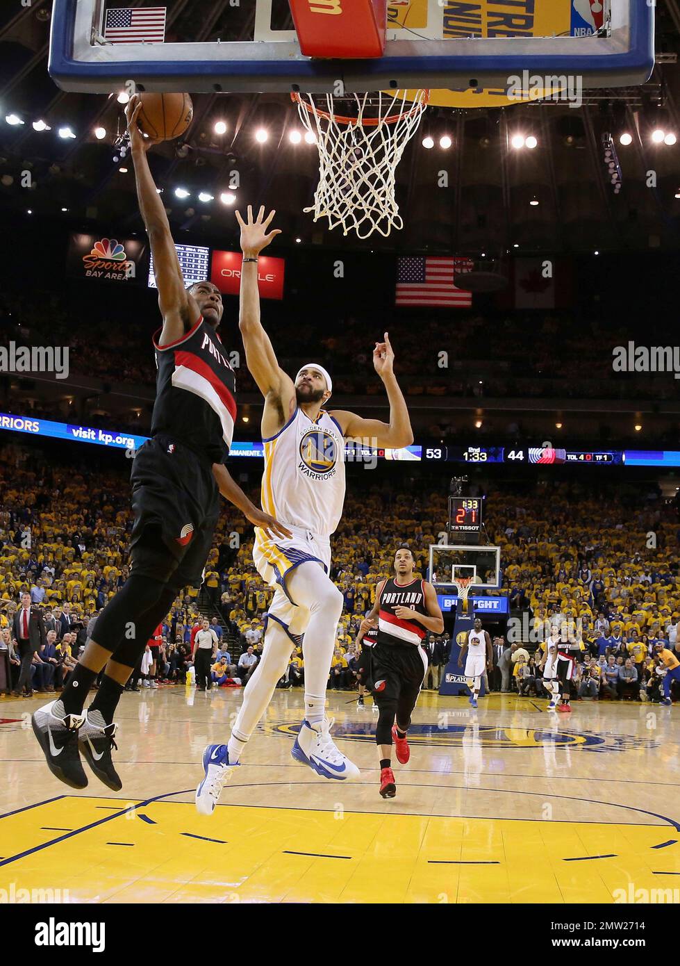 Portland Trail Blazers' Maurice Harkless, left, shoots past Golden ...
