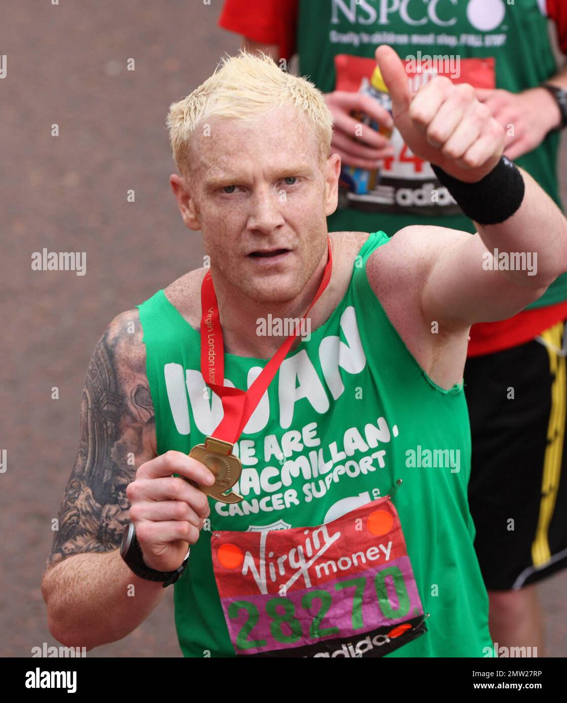 Iwan Thomas at the finish line following the 2011 Virgin London ...