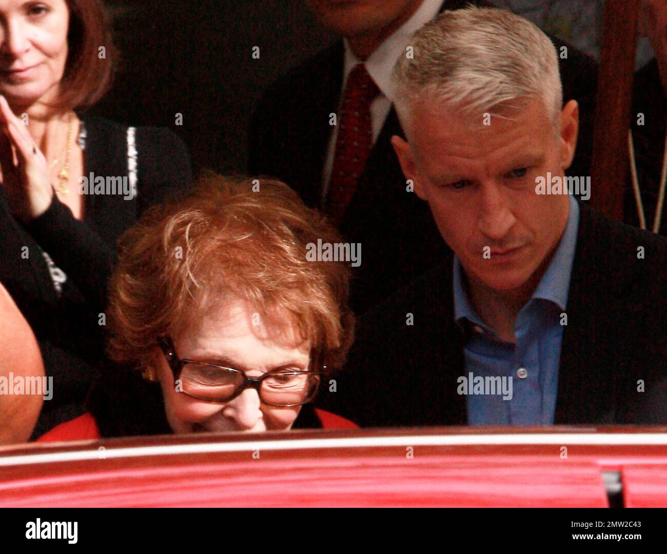 Nancy Reagan, escorted by Anderson Cooper, leaves the annual Von ...