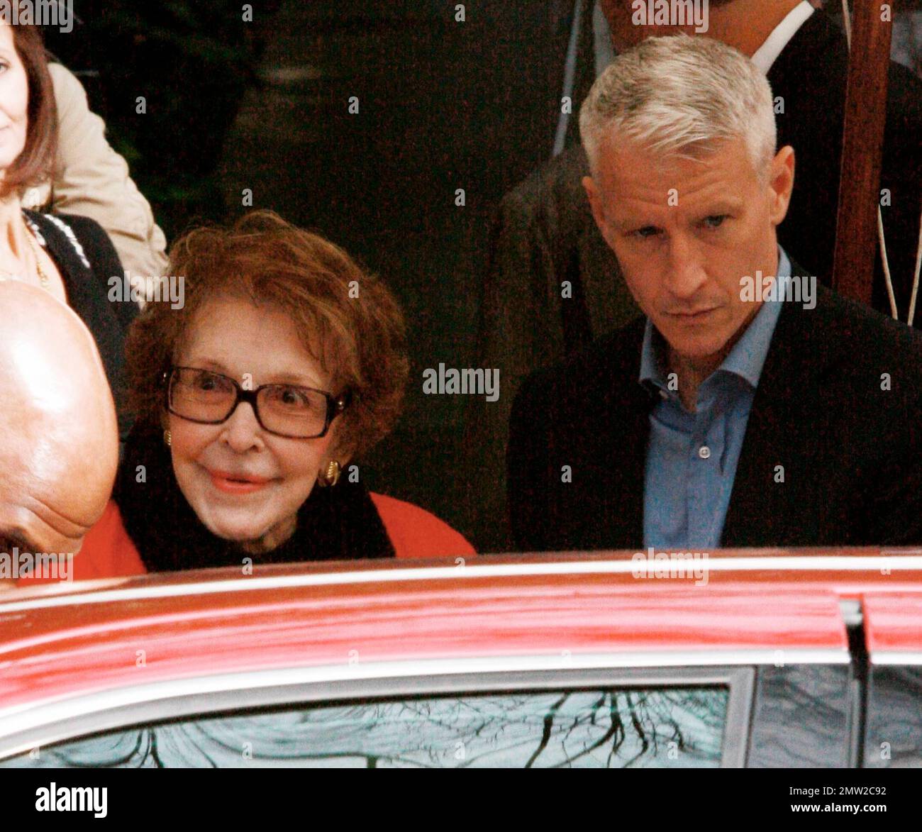 Nancy Reagan, escorted by Anderson Cooper, leaves the annual Von ...