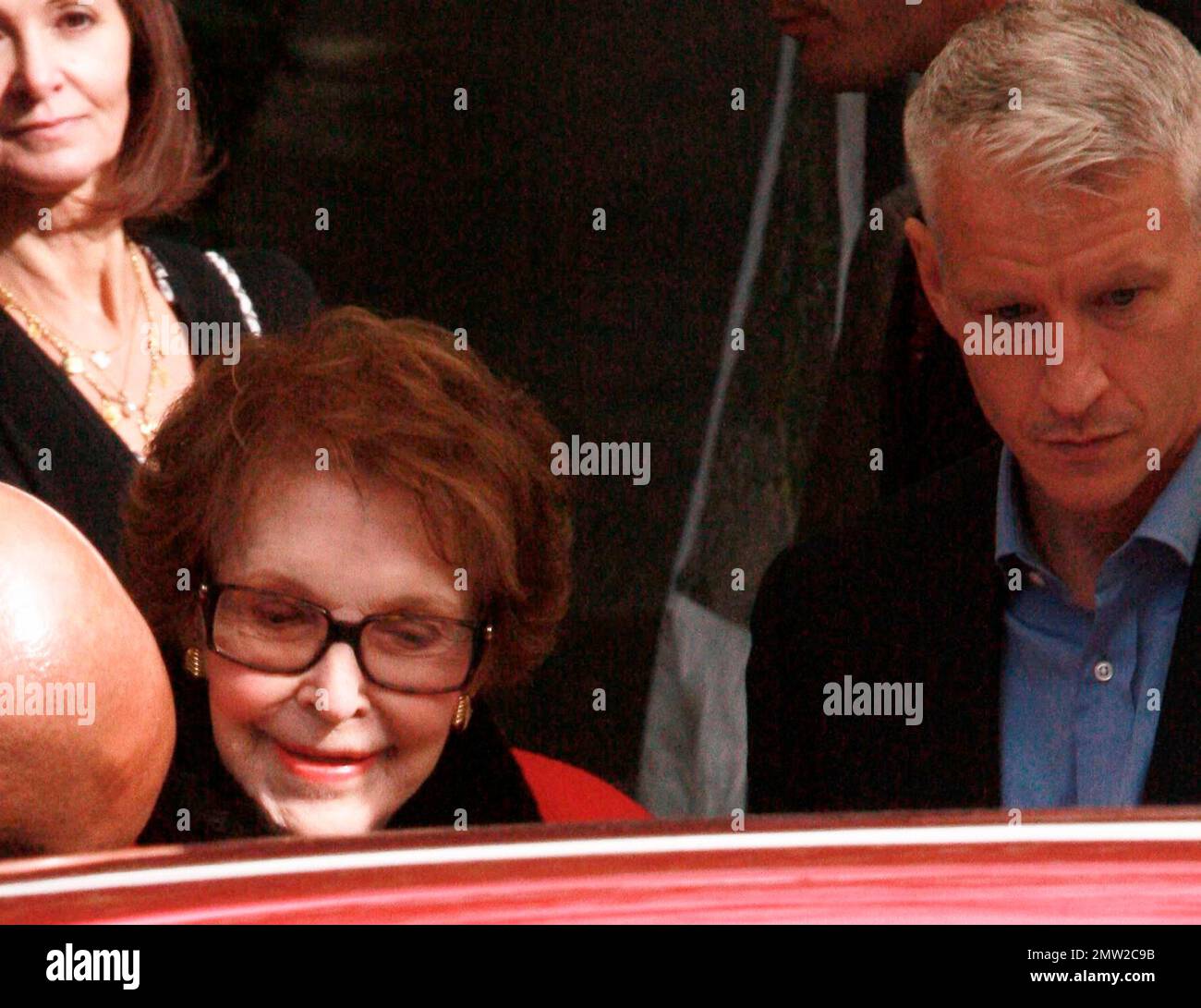 Nancy Reagan, escorted by Anderson Cooper, leaves the annual Von ...