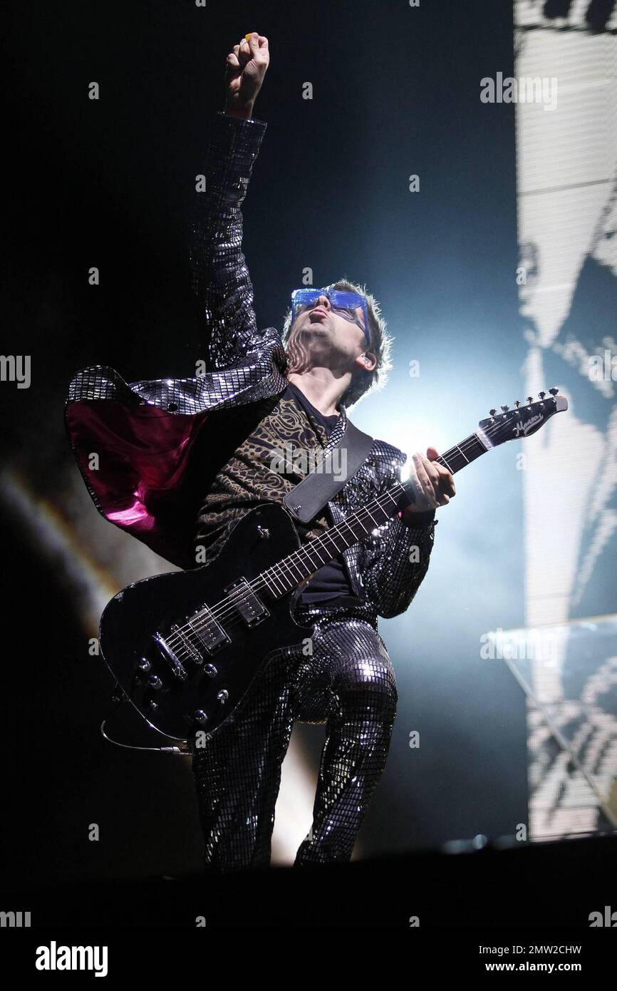 Wearing shutter sunglasses and a sparkly suit Matt Bellamy of Muse ...