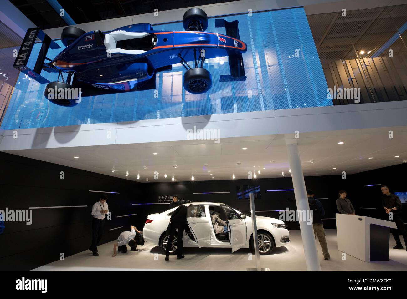 Visitors at the Geely stand during the Auto Shanghai 2017 show at the ...