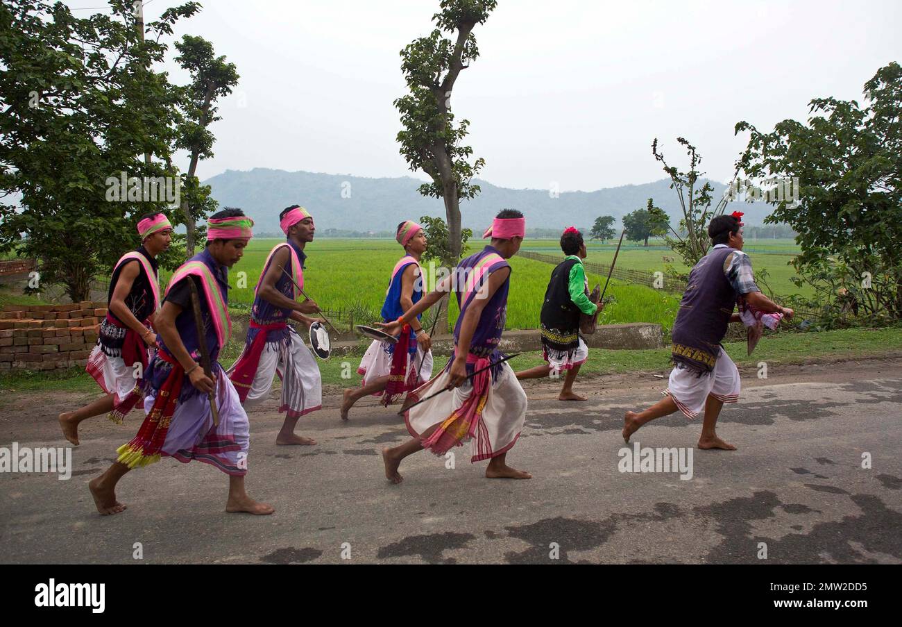 Members of India's Karbi tribe in traditional attire perform a warrior ...
