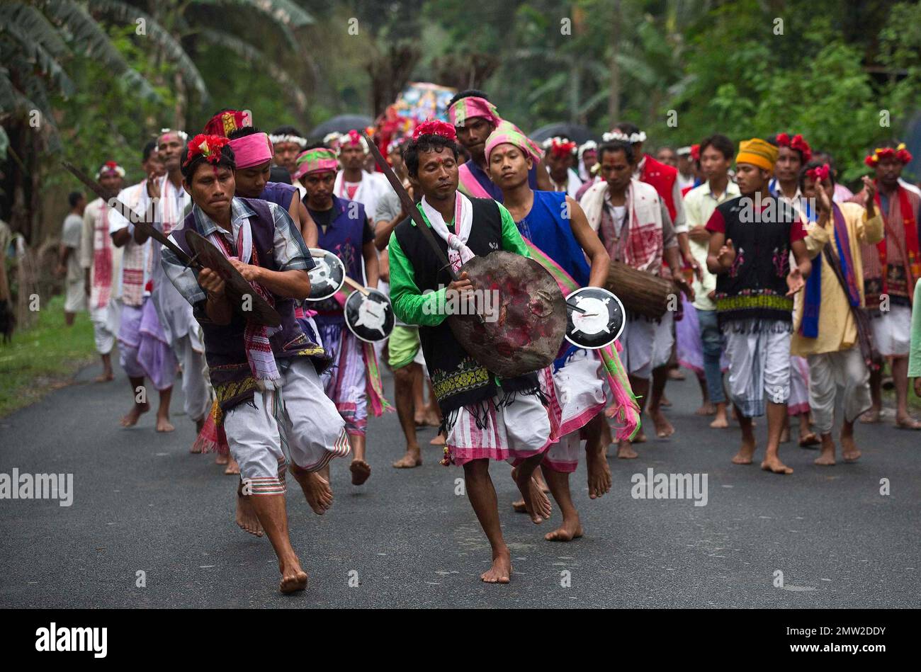 Members of India's Karbi tribe in traditional attire perform a warrior ...