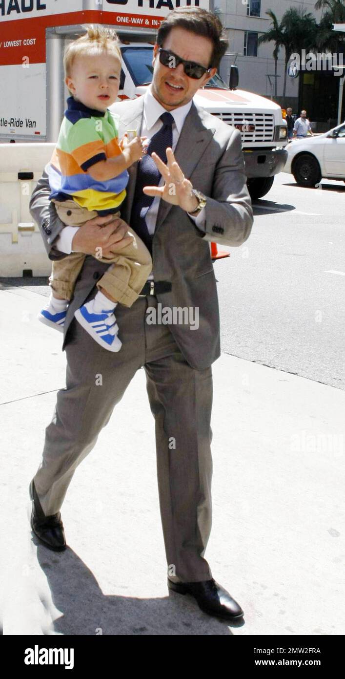 Mark Wahlberg carries son Brendan as they arrive at Hollywood Boulevard ...
