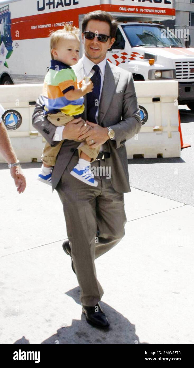 Mark Wahlberg carries son Brendan as they arrive at Hollywood Boulevard ...