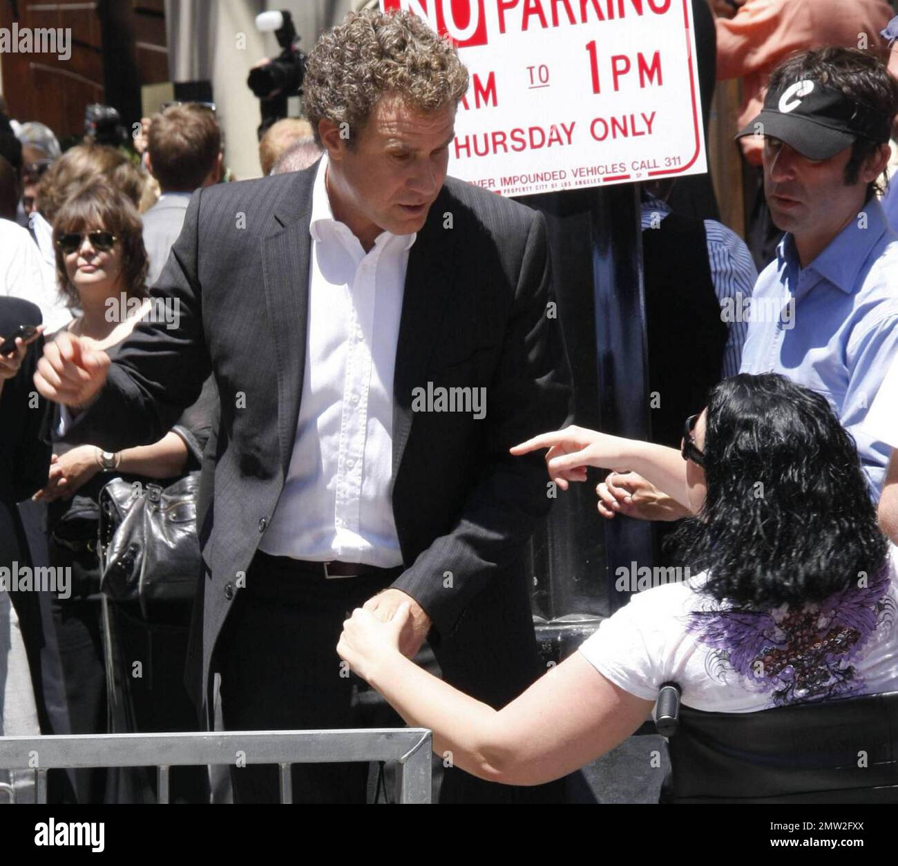 Actor Will Ferrell signs autographs, shakes hands with fans and smiles ...