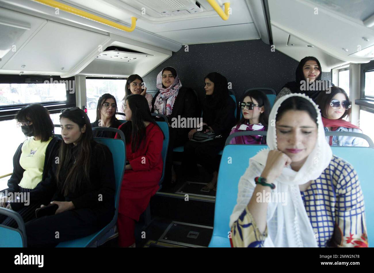 Women are traveling in the bus of Pink Peoples Bus Service after ...