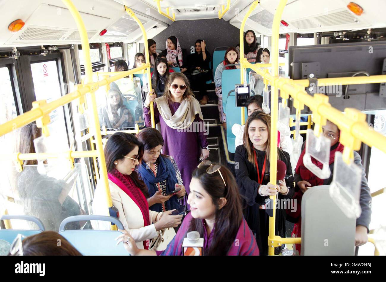 Women are traveling in the bus of Pink Peoples Bus Service after ...