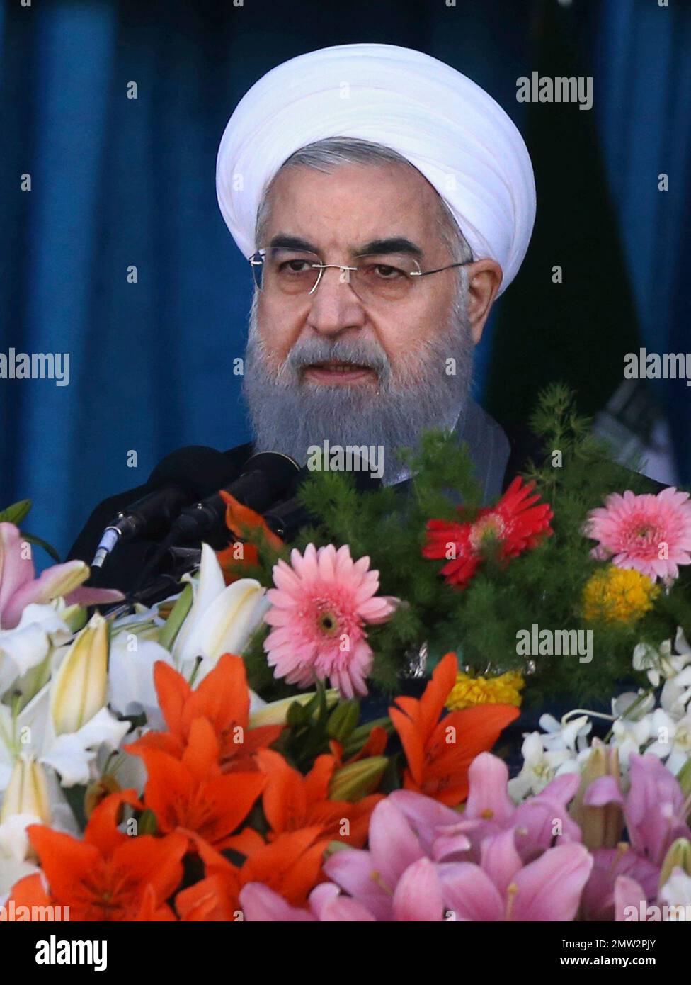 Iranian President Hassan Rouhani speaks before a parade on National ...