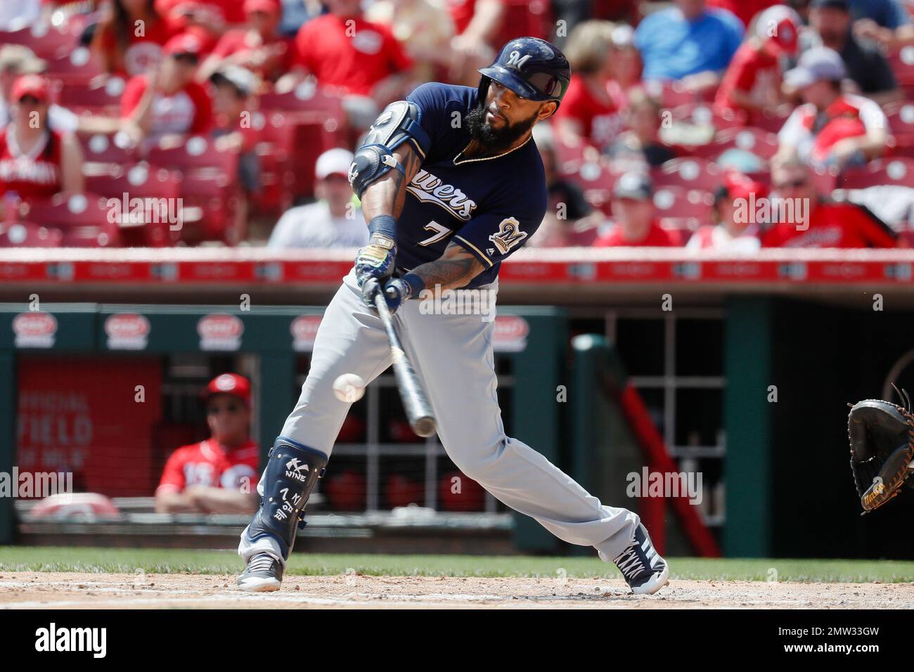 Milwaukee Brewers' Eric Thames hits a ground ball off Cincinnati Reds ...