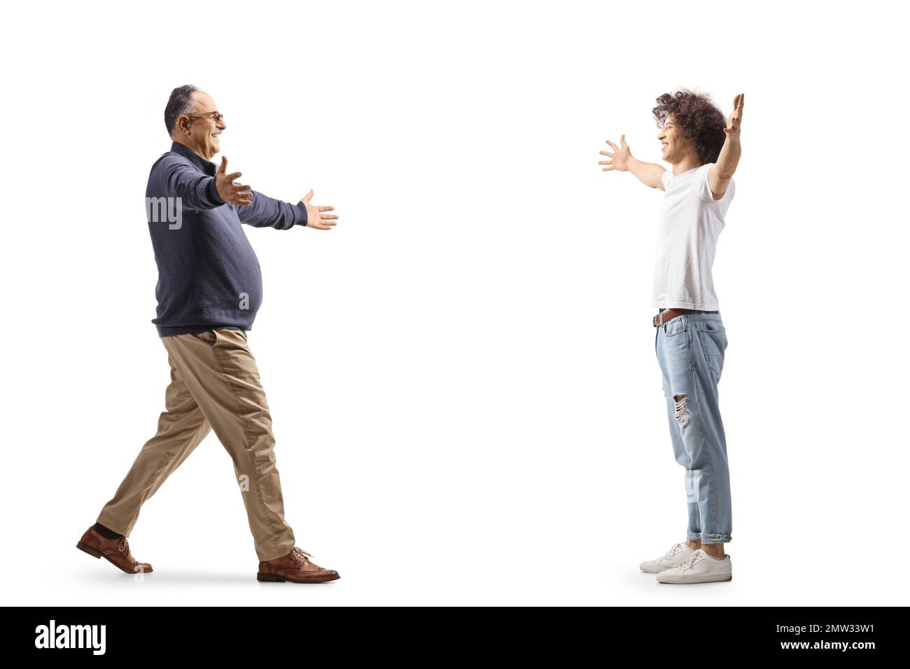 Full length profile shot of a young man waiting to hug his father ...