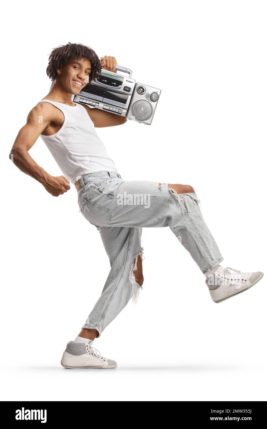 Cheerful afircan american man dancing and carrying a boombox on ...