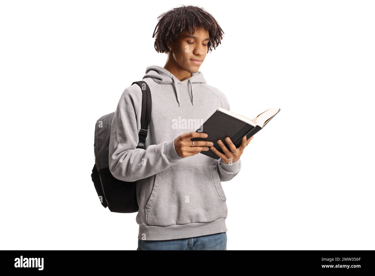 Male african american student with a backpack standing and reading a ...