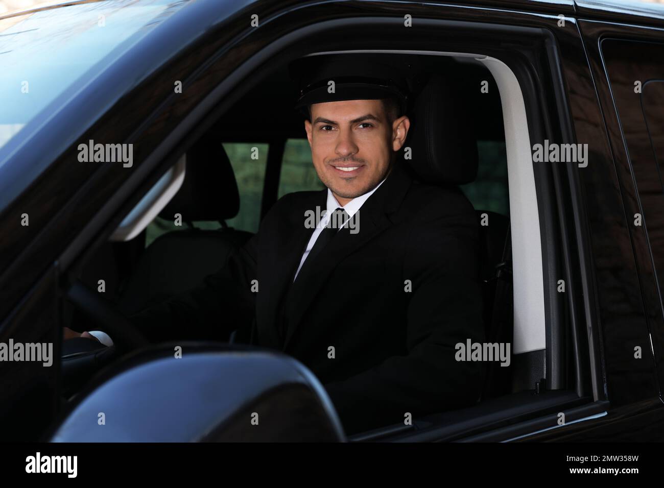 Professional driver in luxury car. Chauffeur service Stock Photo - Alamy