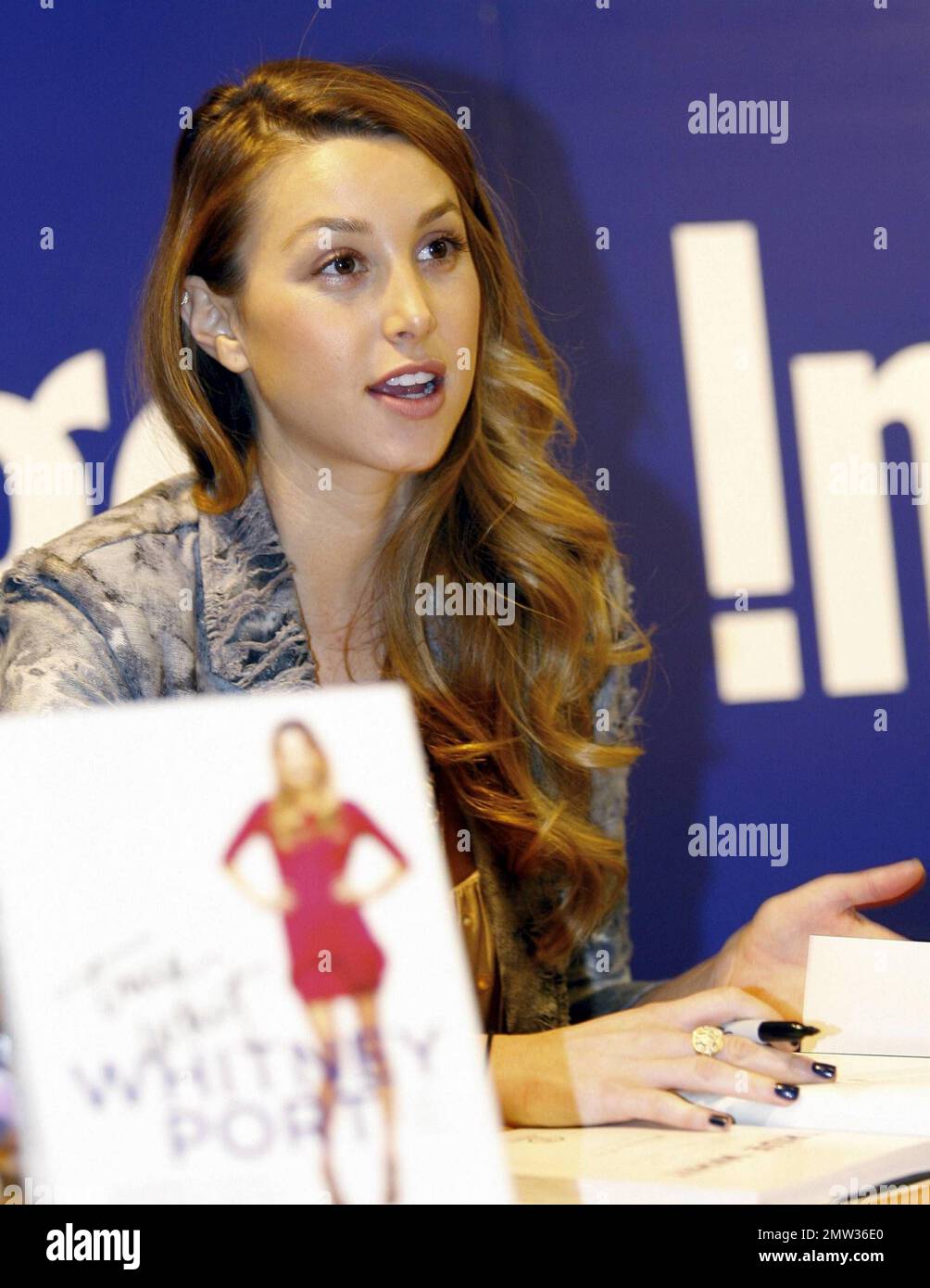 MTV reality star and clothing designer Whitney Port signs copies of her ...