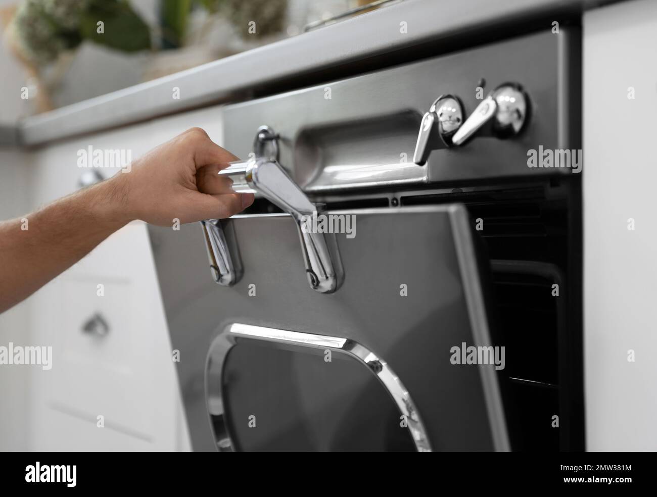 Person using gas cooker hi-res stock photography and images - Alamy