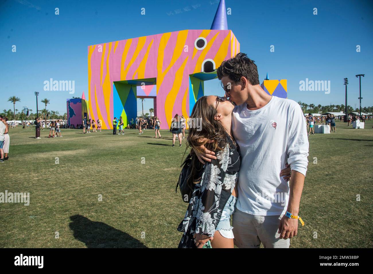 Festival goers Emily Willett, left, and Ben Egan pose at Coachella ...