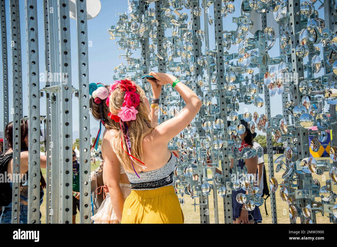 Festival goers Maisie Hoile, left, and Lucie Maguire take a selfie at ...