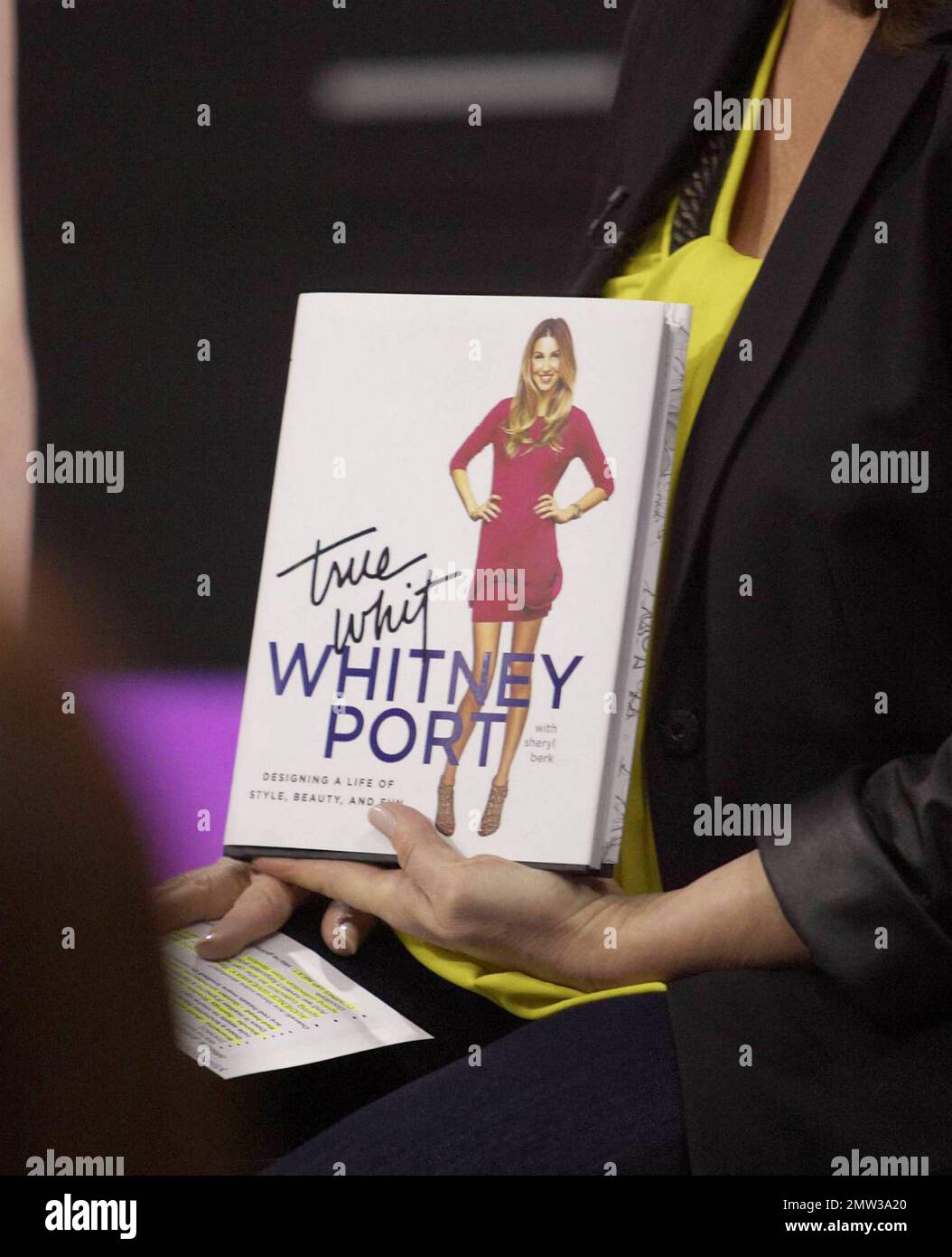 In a patterned scarf, tan blouse and mini skirt reality TV star Whitney ...