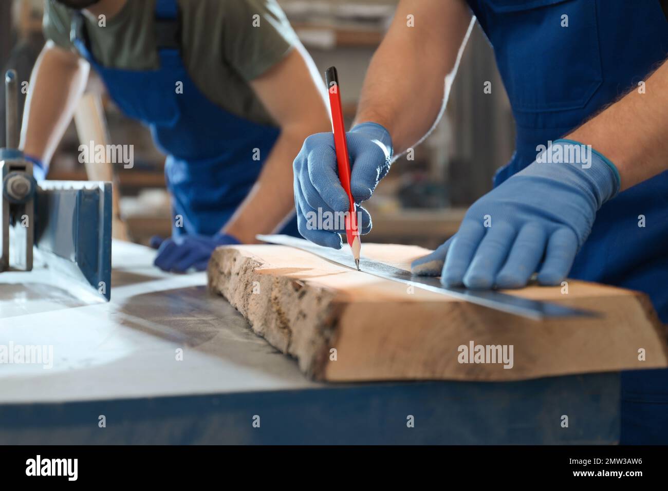 Professional carpenters working with wood in shop, closeup Stock Photo ...