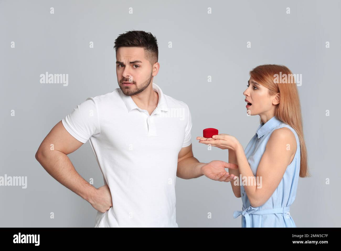 Young woman with engagement ring making marriage proposal to her ...