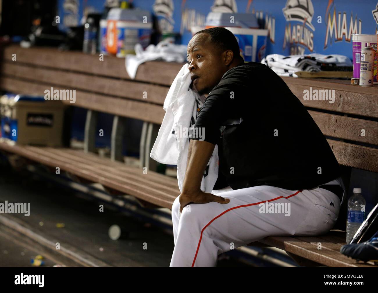 Miami Marlins starting pitcher Edinson Volquez sits in the dugout after ...