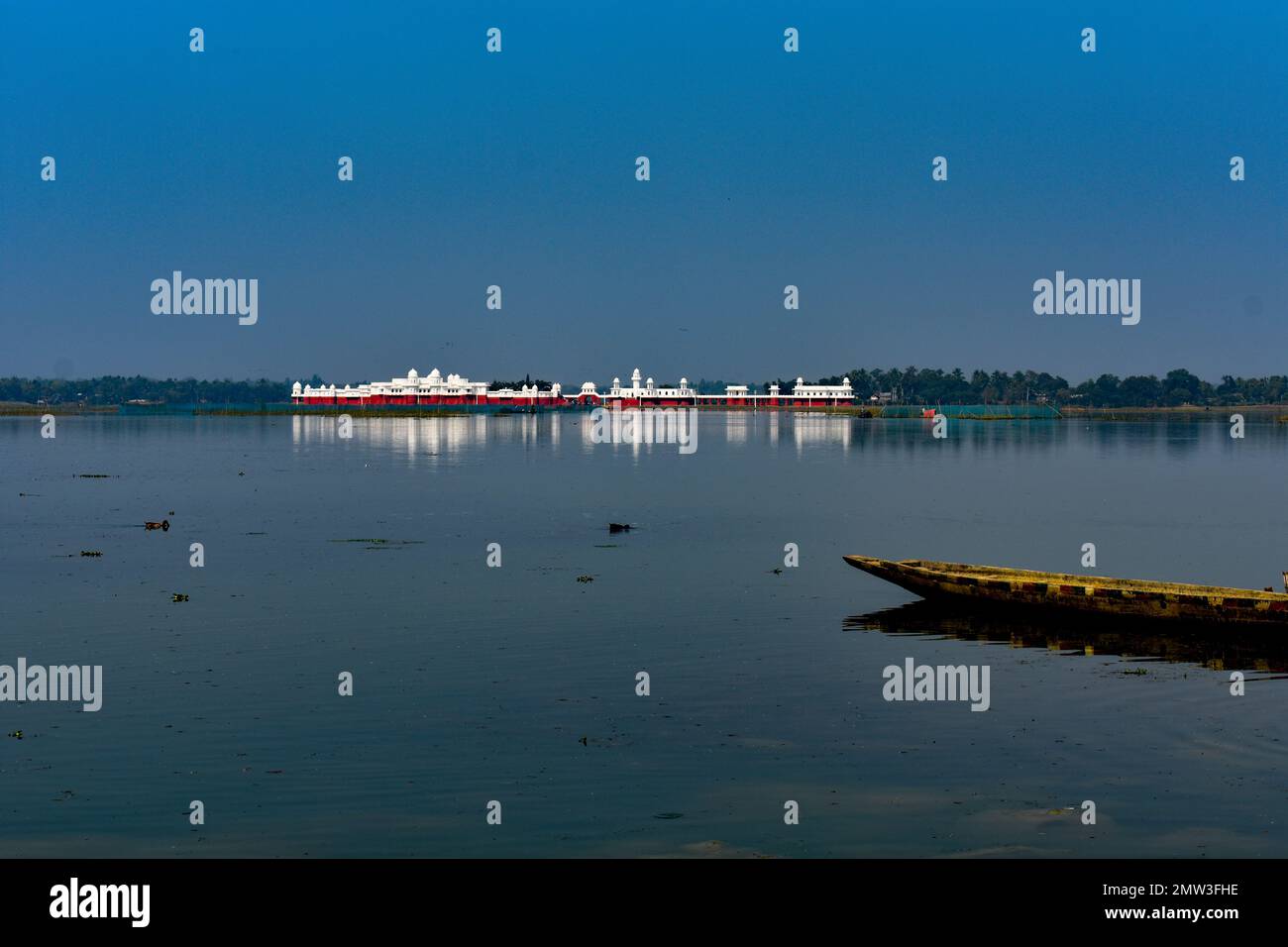 A view of Nirmahal and boats in Rudrasagar lake in Tripura , India ...