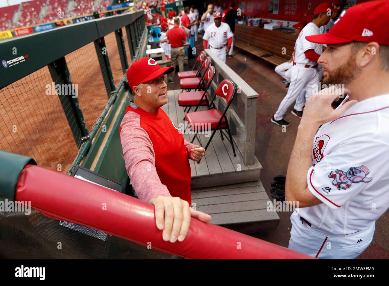 Cincinnati Reds manager Bryan Price, left, speaks with starting pitcher ...