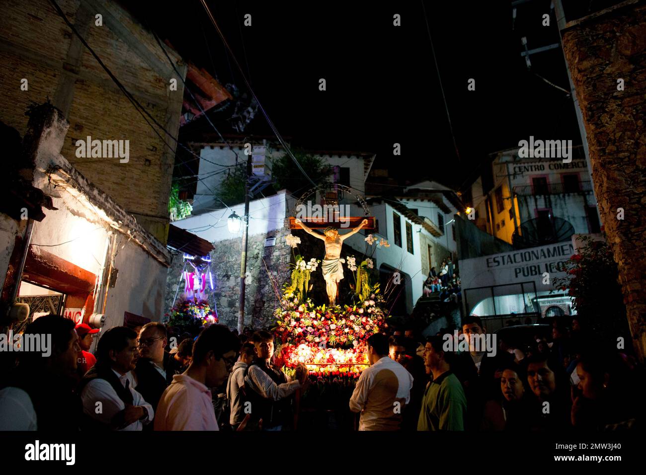 Church groups carry representations of Christ on the cross as they walk ...