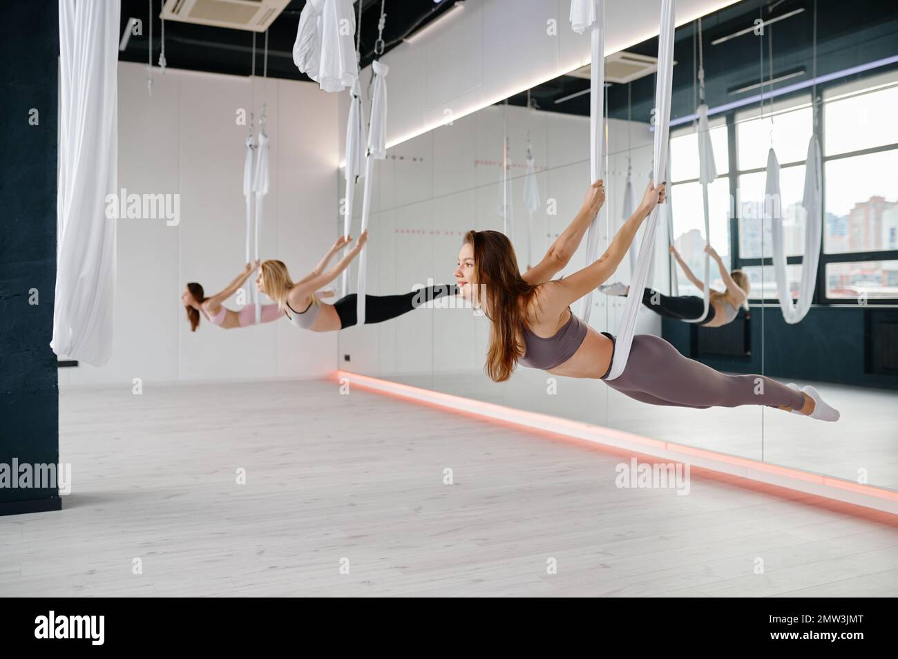 Fly yoga woman doing exercises hi-res stock photography and images - Alamy