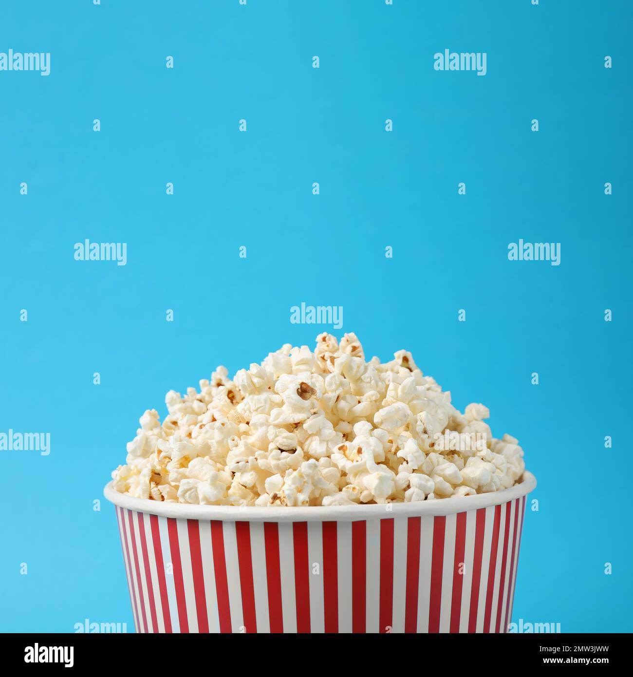 Delicious popcorn on light blue background, closeup Stock Photo - Alamy