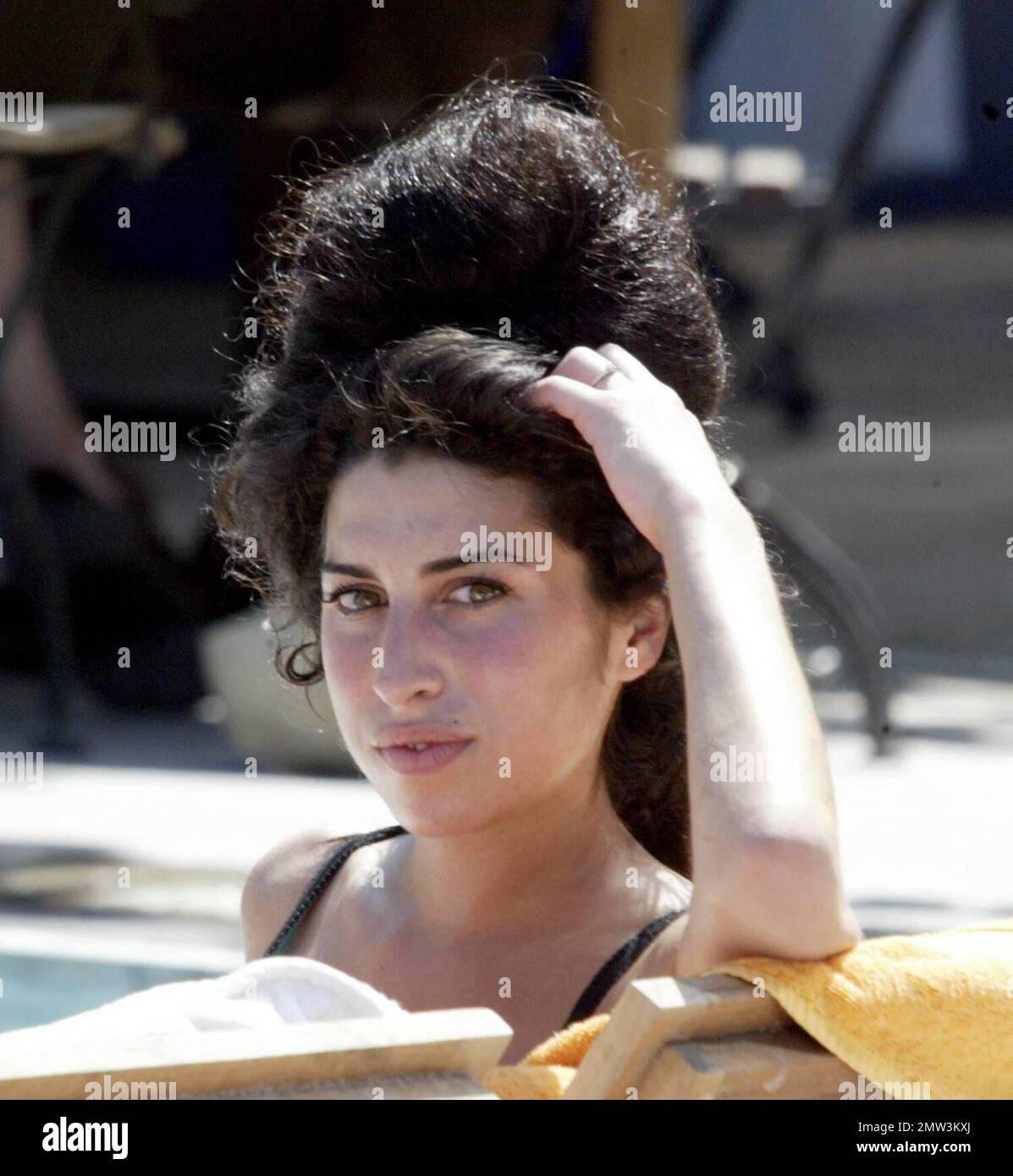 "Rehab" singer Amy Winehouse displayed her tattoos and scars in a ...
