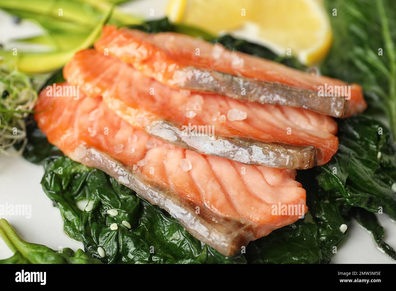 Tasty freshly cooked salmon with spinach, closeup Stock Photo - Alamy