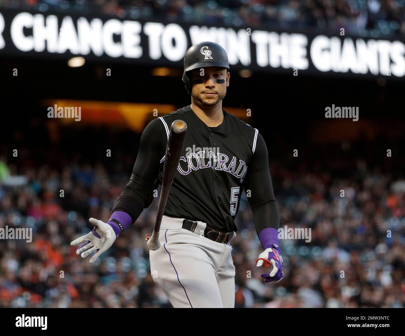 Colorado Rockies' Carlos Gonzalez (5) tosses his bat after striking out ...