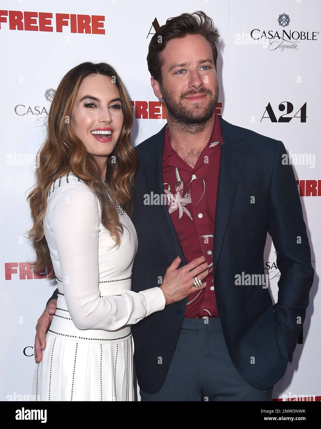 Elizabeth Chambers, left, and Armie Hammer arrive at the Los Angeles ...