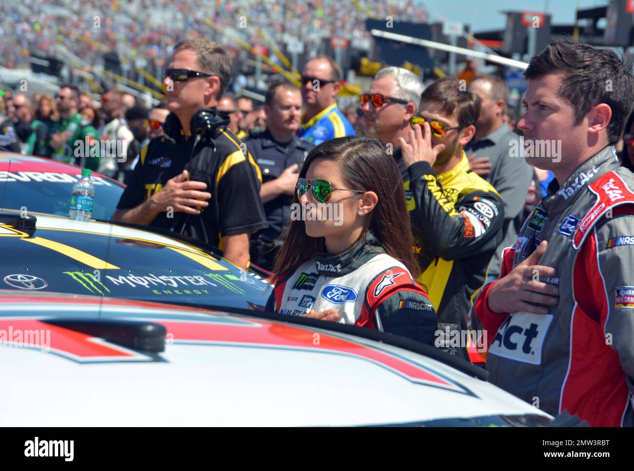 Danica Patrick stands with her crew during the playing of the national ...