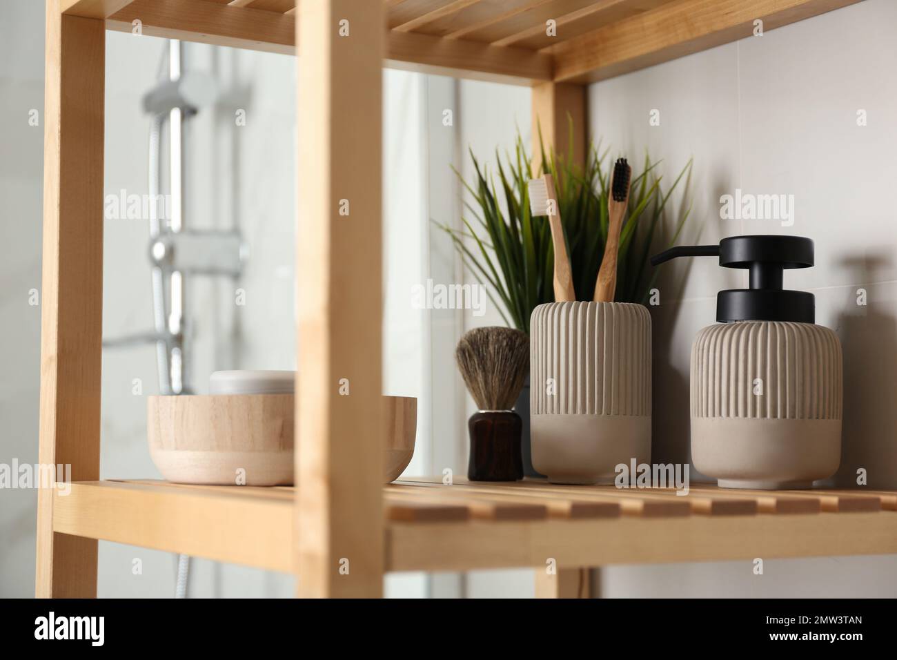 Shelving unit with toiletries in bathroom interior Stock Photo - Alamy