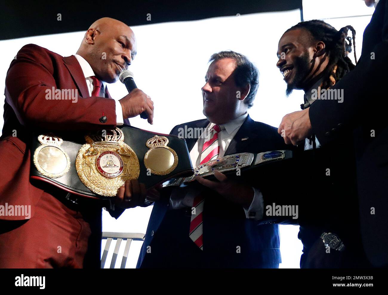 New Jersey Gov. Chris Christie, center, is presented with a belt by ...